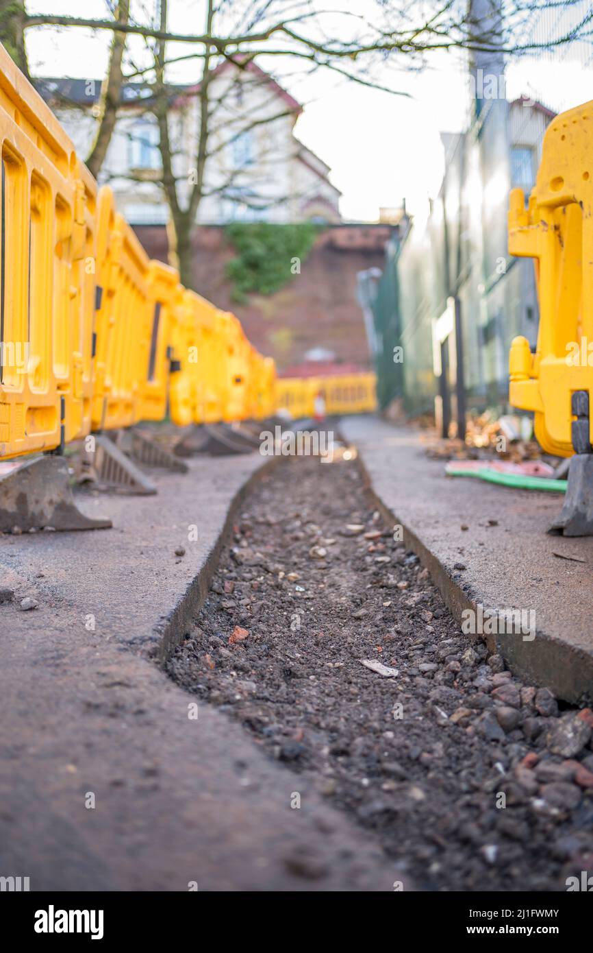 Pathway repair with barriers in place Stock Photo - Alamy