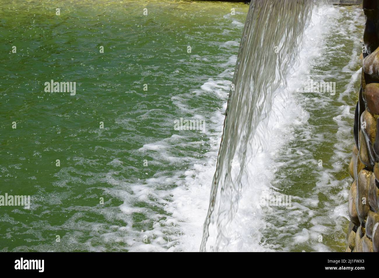landscape of beautiful Artificial waterfall in garden at the public ...