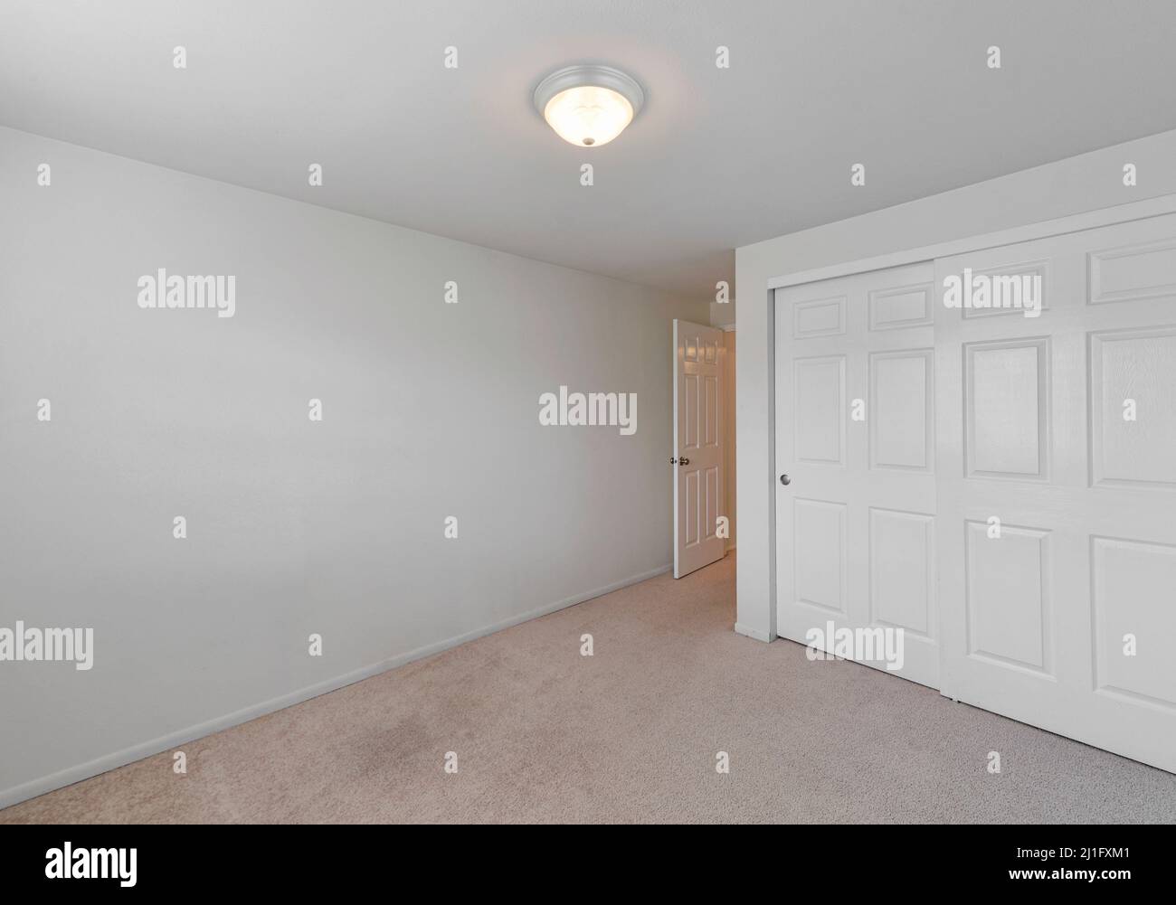 Modern residential empty bedroom interior Stock Photo - Alamy