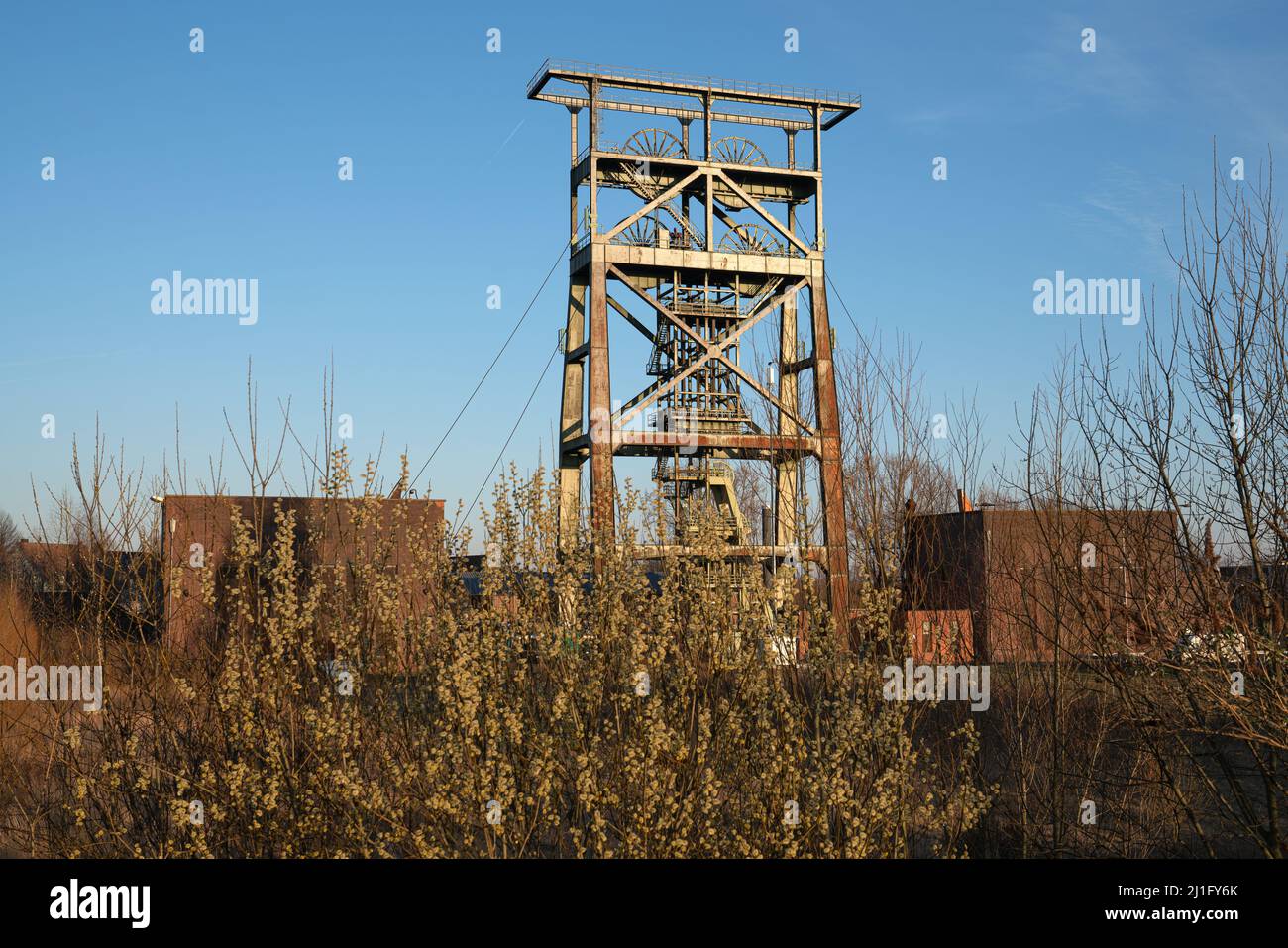 The frame of an old cold mine against a blue sky in, Dortmund, Germany ...