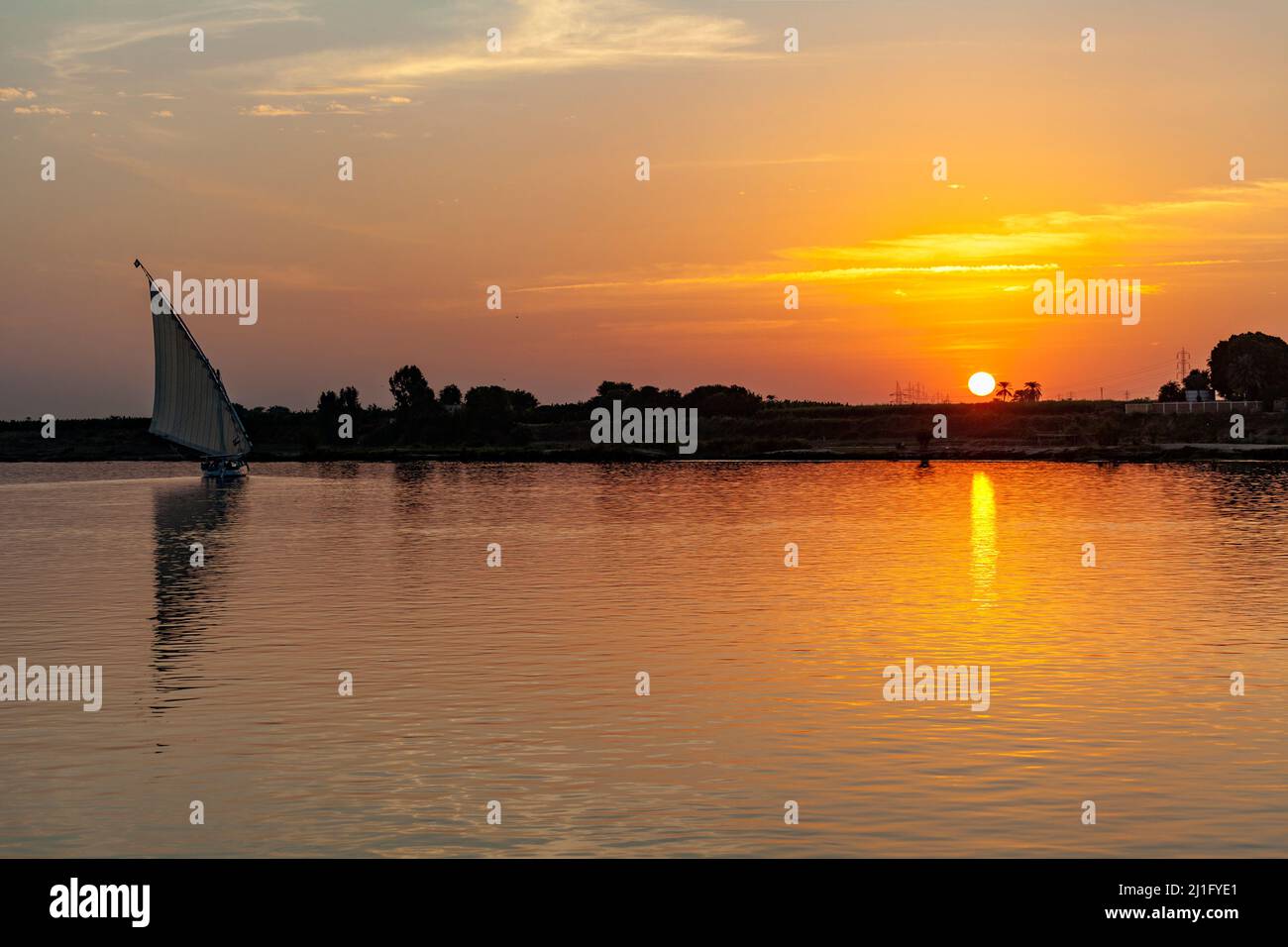 Sunset on the Nile with felucca, Luxor Stock Photo - Alamy