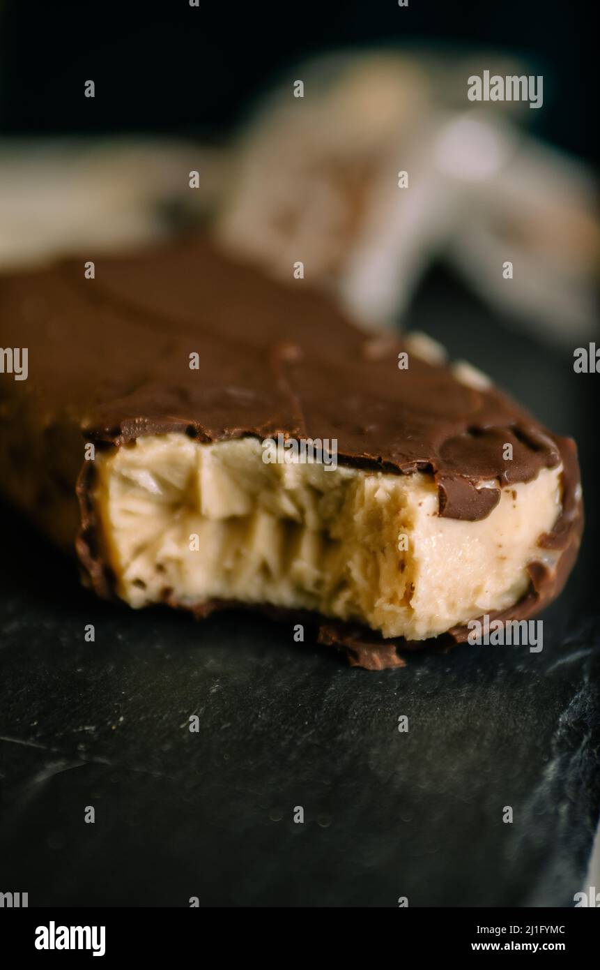 A portrait of an ice cream popsicle with a bite on the corner Stock ...