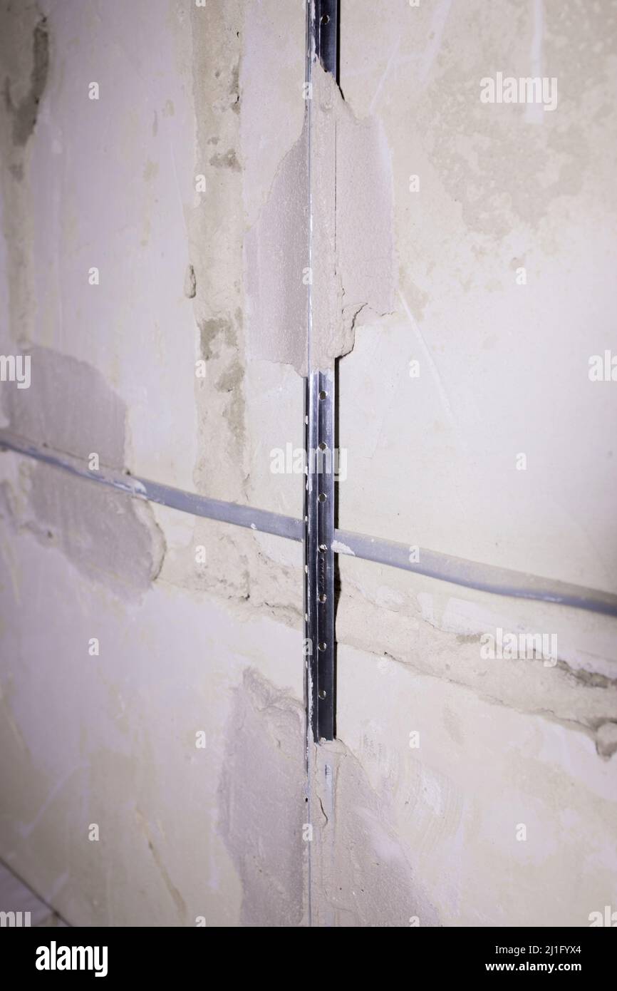 Electrical Cable laying on wall. Wiring replacement. Connecting light ...