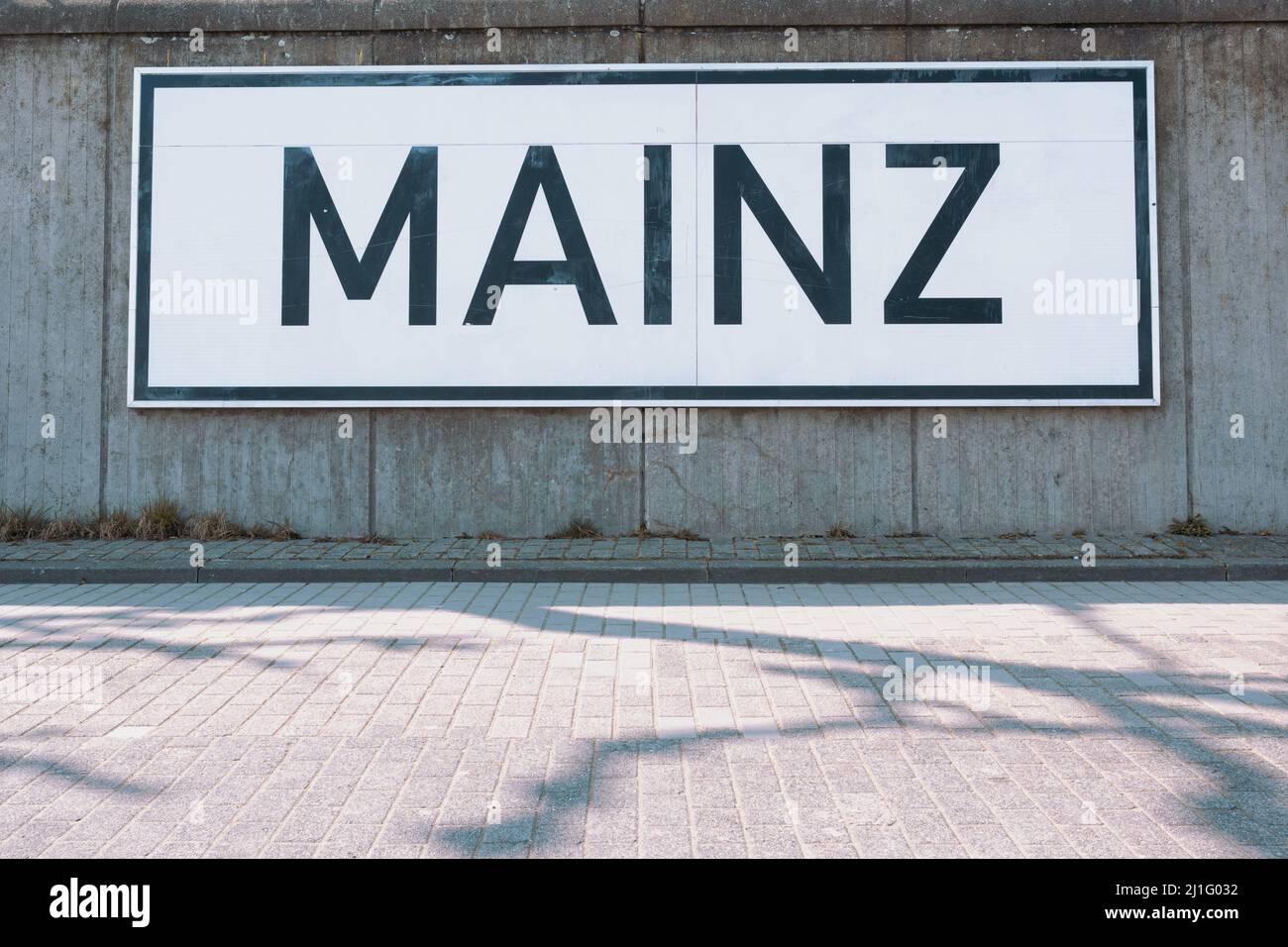 city sign of Mainz hanging on a wall near the river sign Rhine to ...