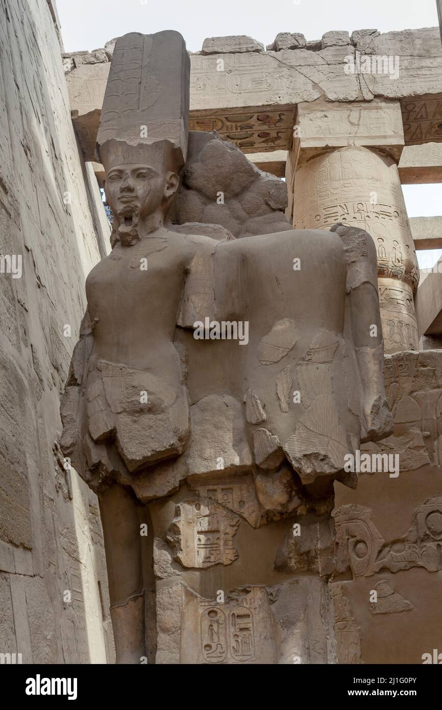 Remains of statue of the God Amun Ra in the Great Hypostyle Hall at ...