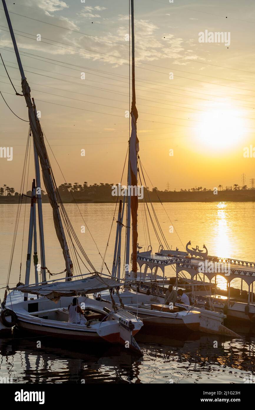 Feluccas and sailing boat moored on the Nile, Luxor Stock Photo - Alamy