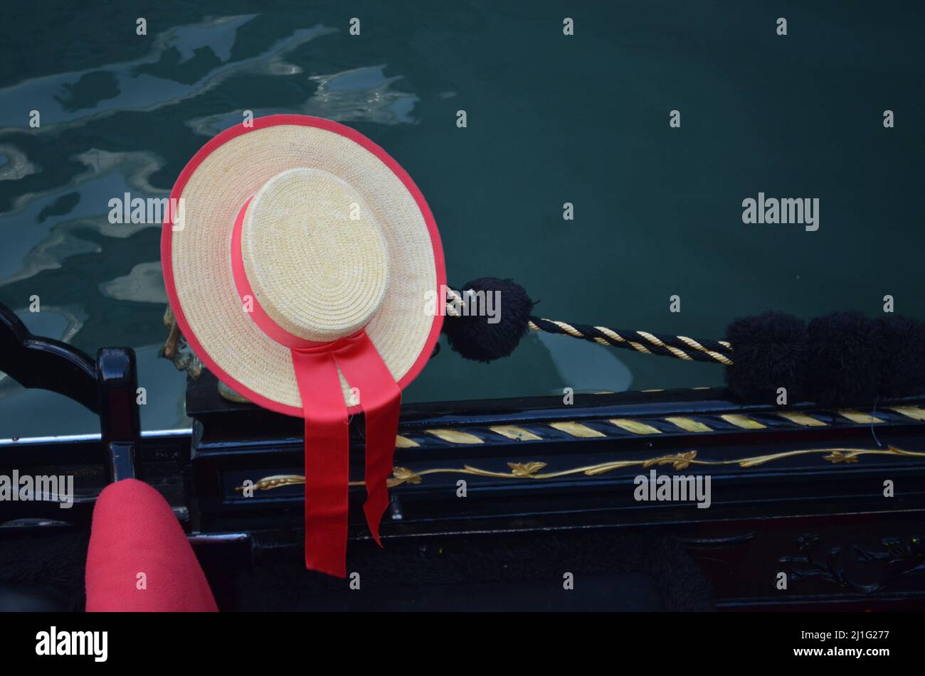 A vintage straw hat with a pink ribbon on a boat Stock Photo - Alamy
