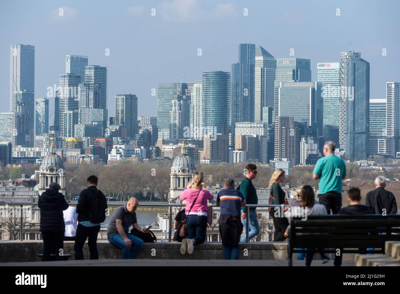 London, UK. 25th Mar, 2022. UK Weather : People enjoy the view of ...