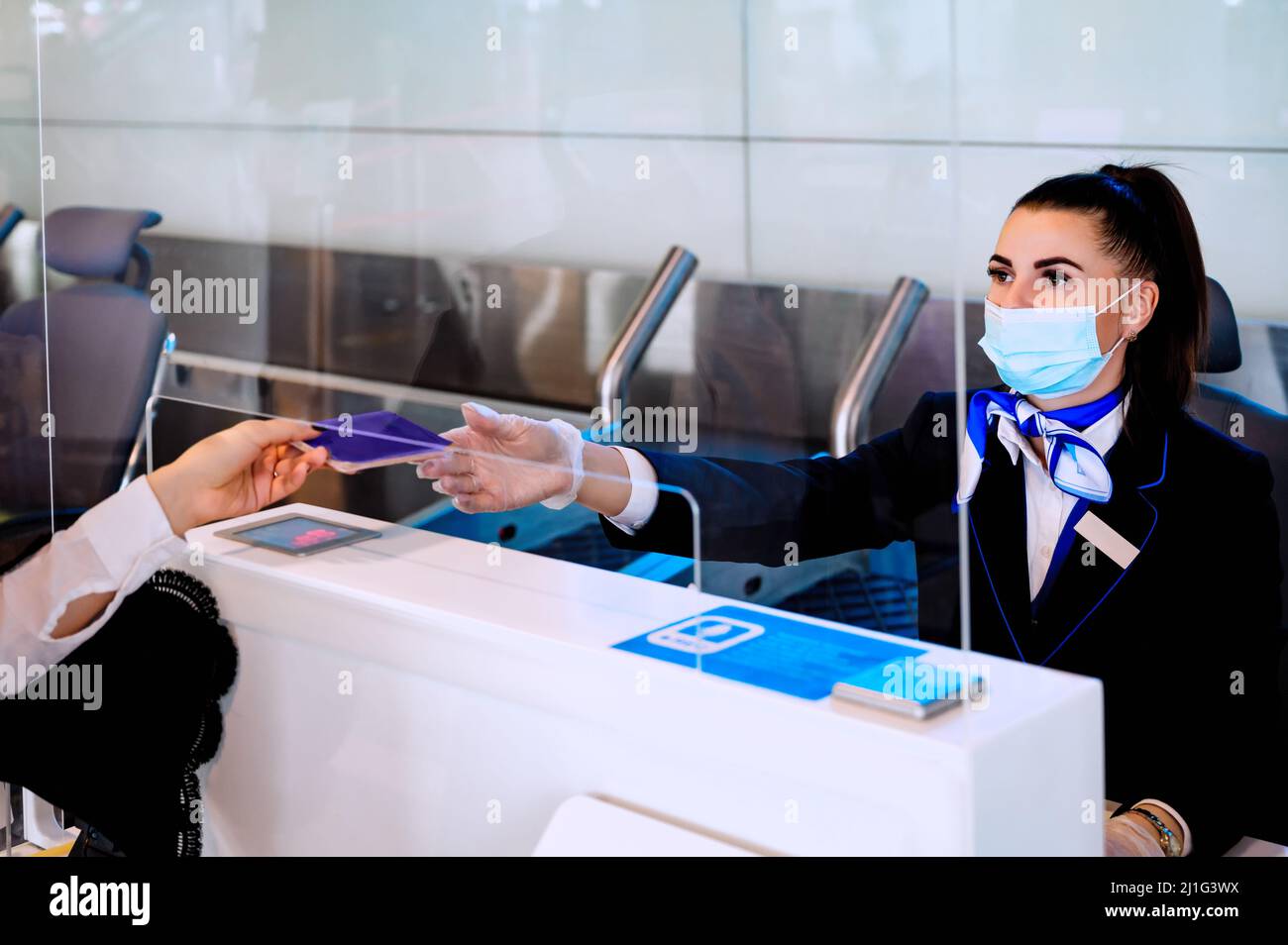 Flight staff taking passport hi-res stock photography and images - Alamy
