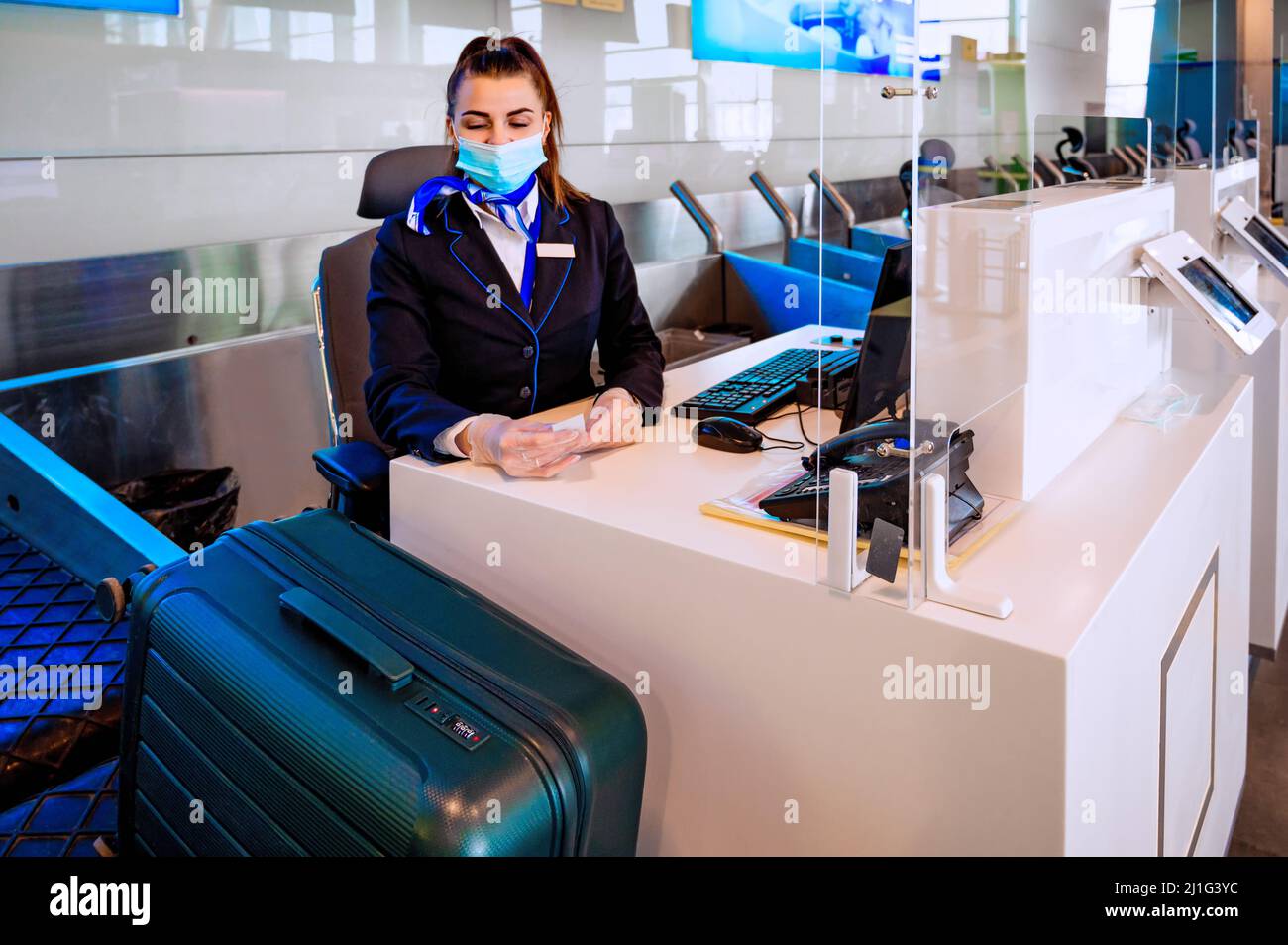 Weighing luggage at an airport hi-res stock photography and images - Alamy