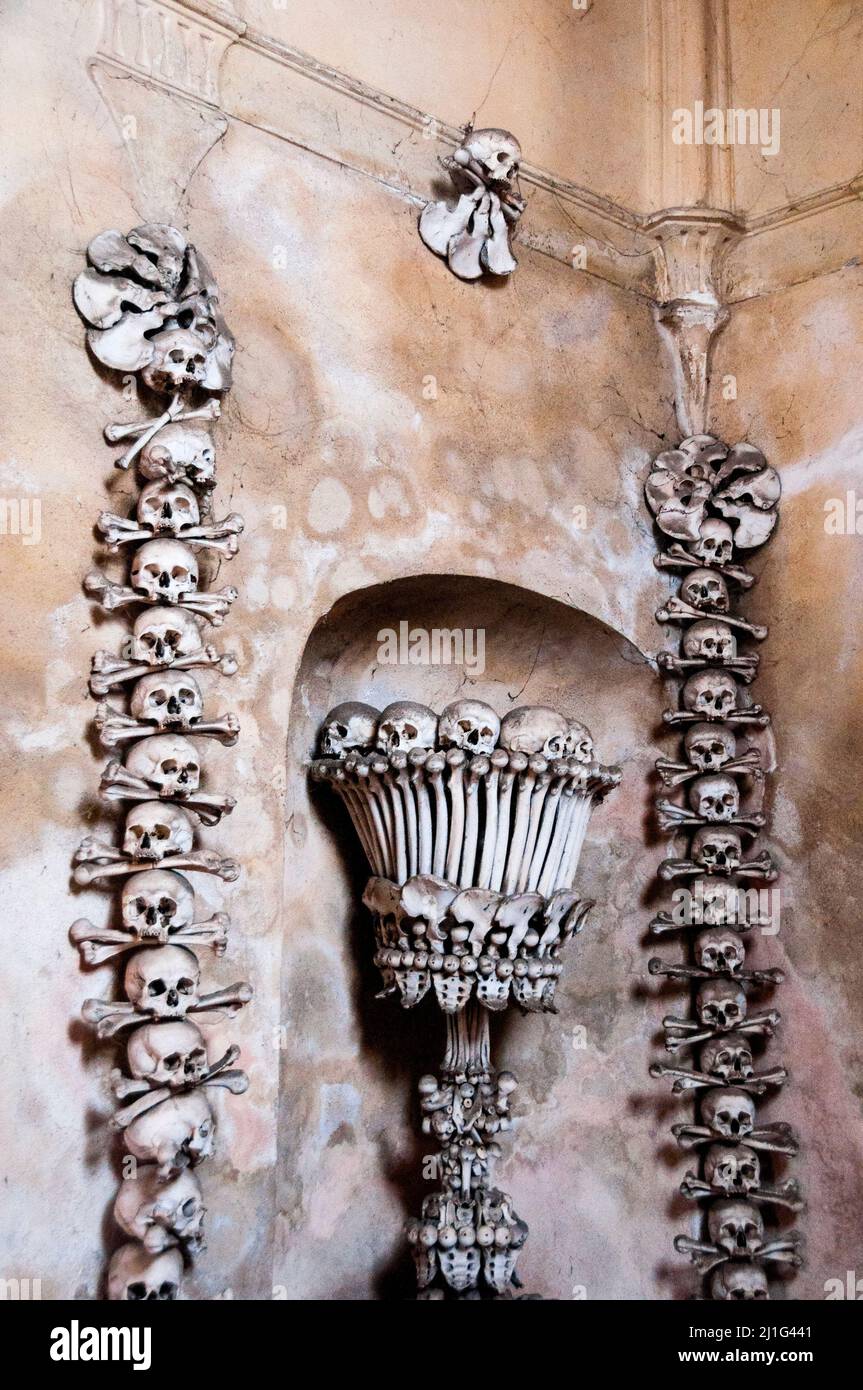 Bone Chalice and Greeters sit in a niche at the Bone Chapel in Kutná ...