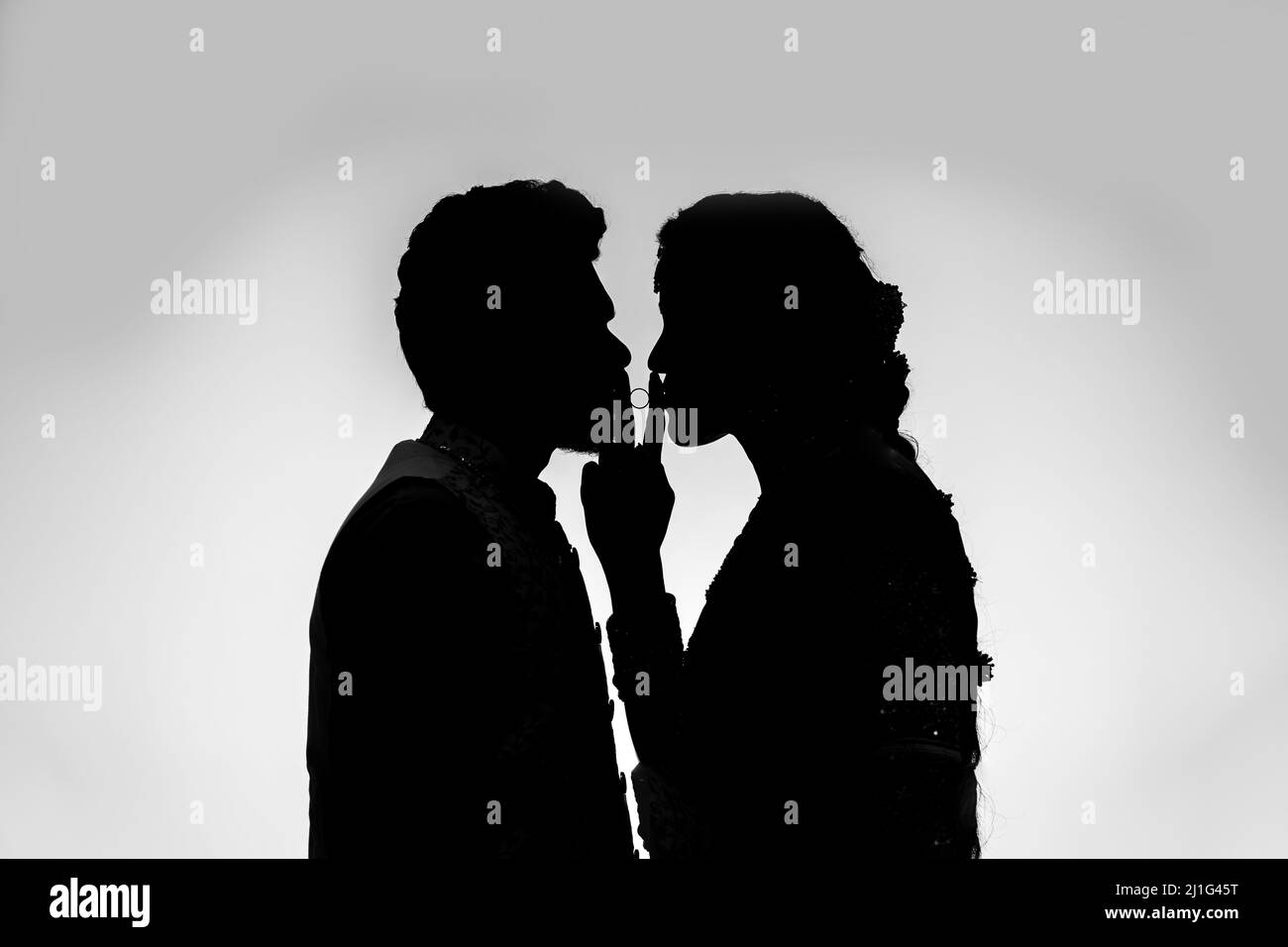 a photo of silhouette of engagement couple Stock Photo - Alamy