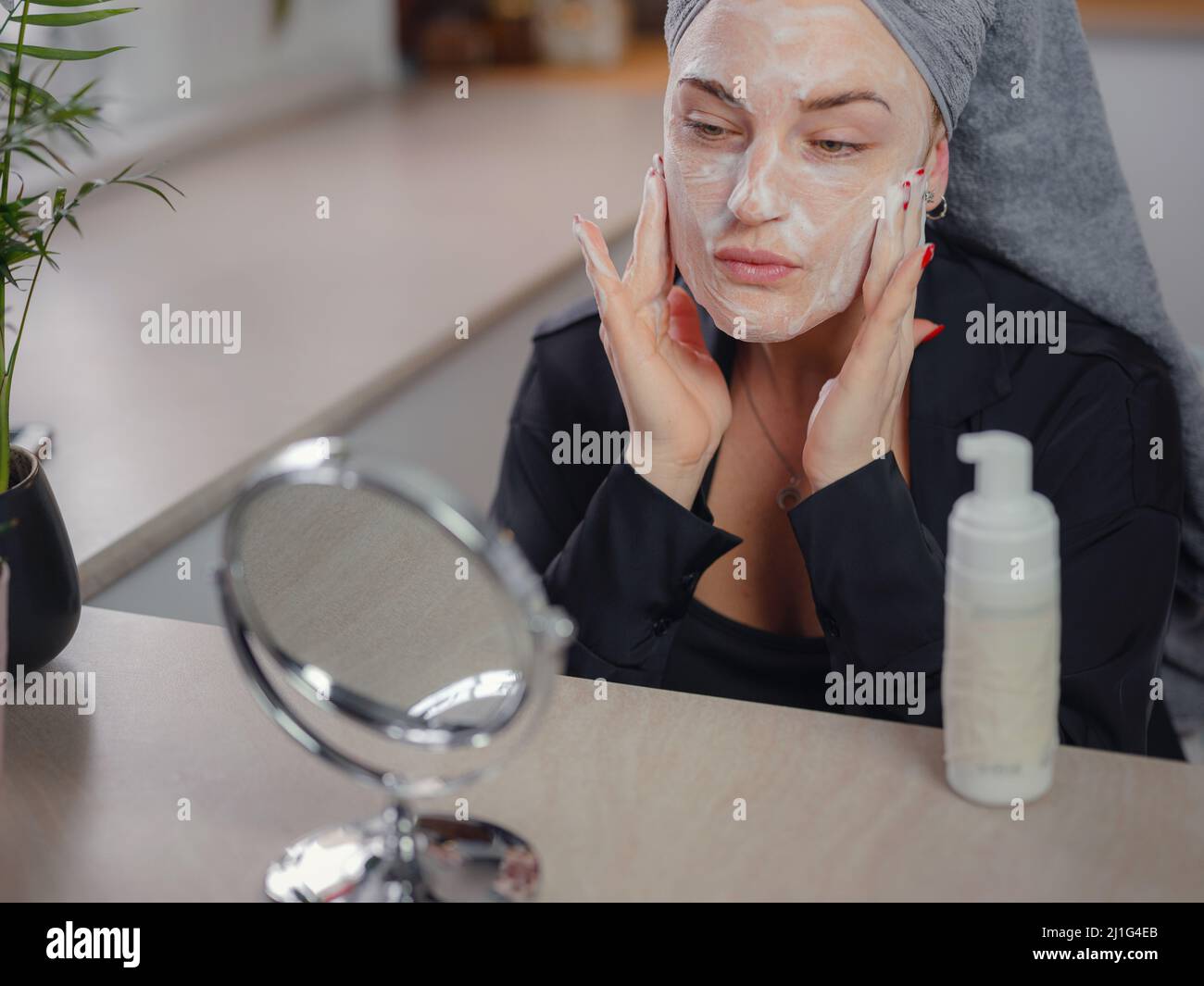 Enjoying flawless skin . Peaceful lady being satisfied with condition ...