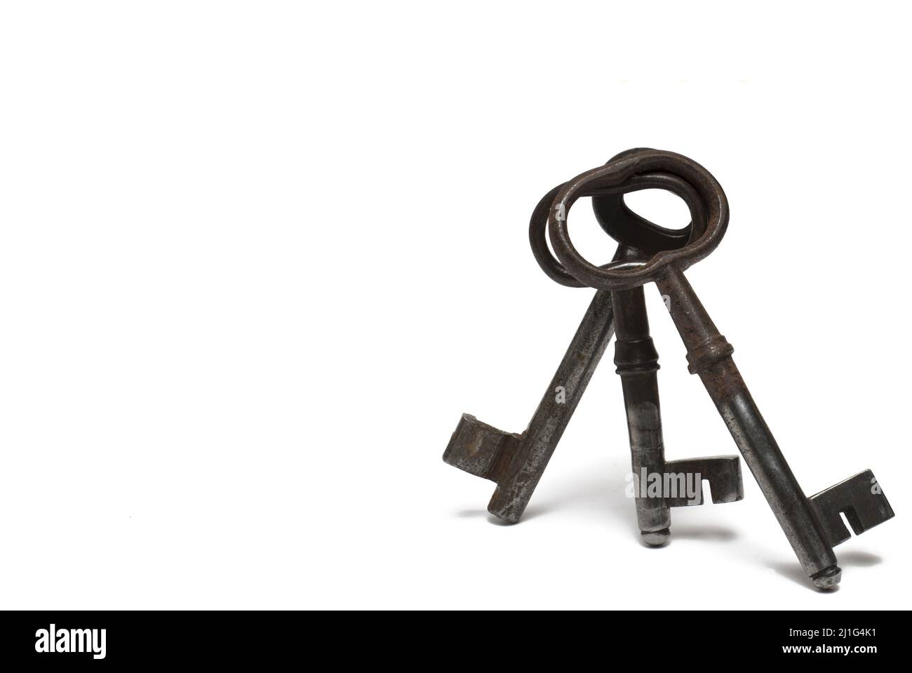 Close up of three old retro vintage rusted heavily used beard keys ...