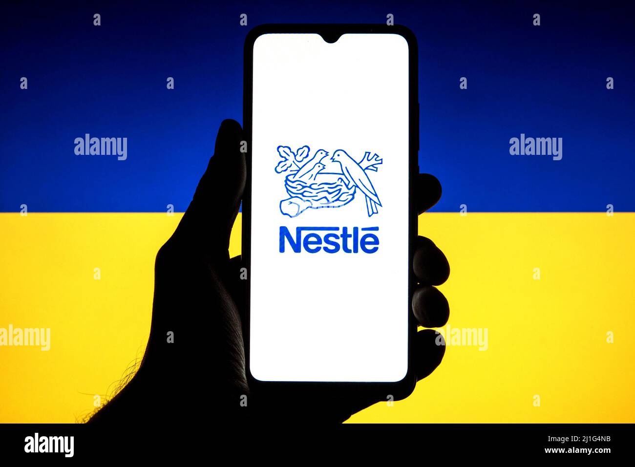 In this photo illustration a Nestle S.A logo seen displayed on a ...