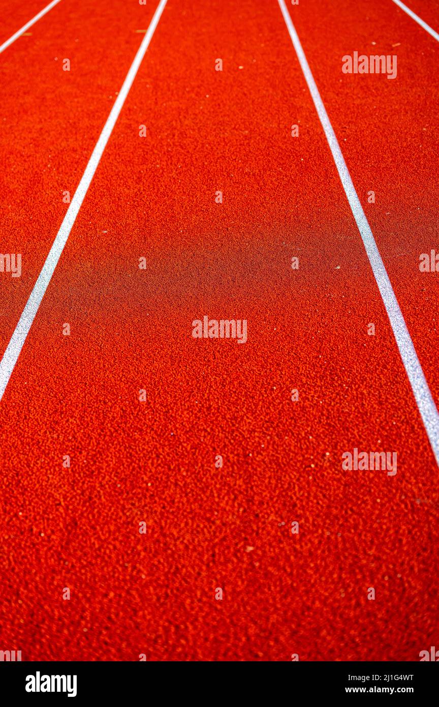 red runninng race track with border lanes, treadmill at stadium, sport ...