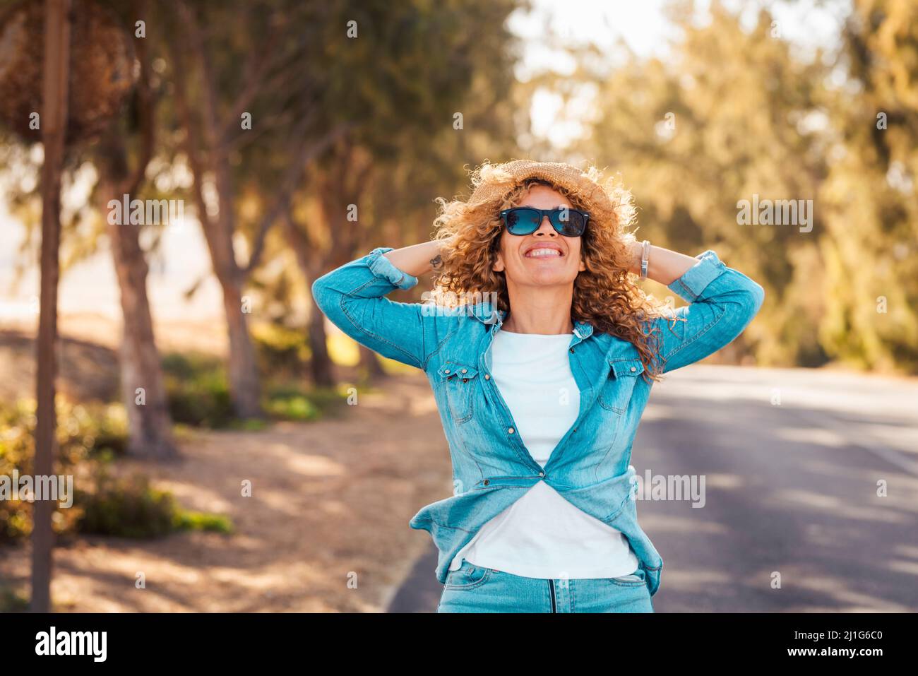 Happy and enjoyed cheerful pretty adult woman in outdoor leisure ...