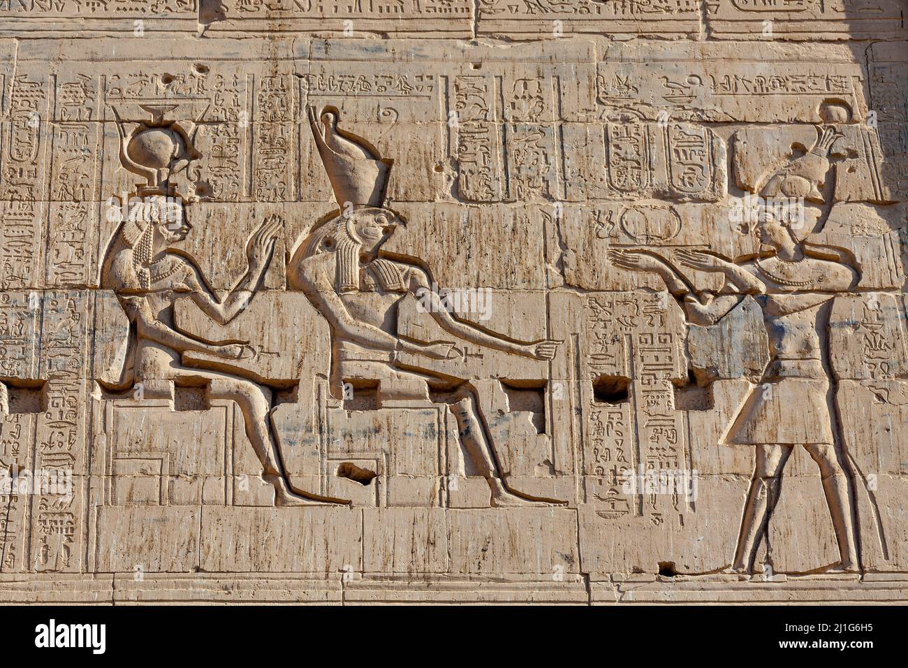 Carvings of a Ptolemaic pharaoh making offerings to the gods on the ...