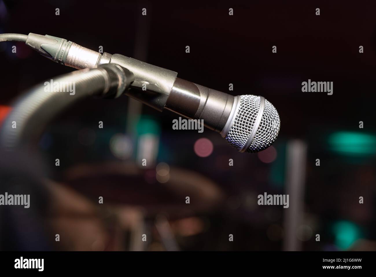 Microphone on blurry abstract background of expression in light seminar ...