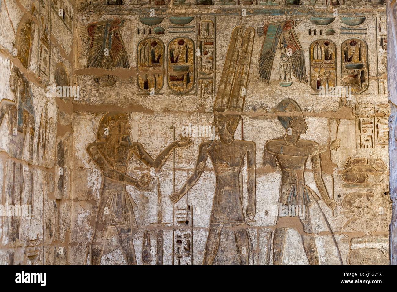 Wall carving of the pharaoh Ramesses III making an offering to the god Amun-Ra in the Mortuary ...