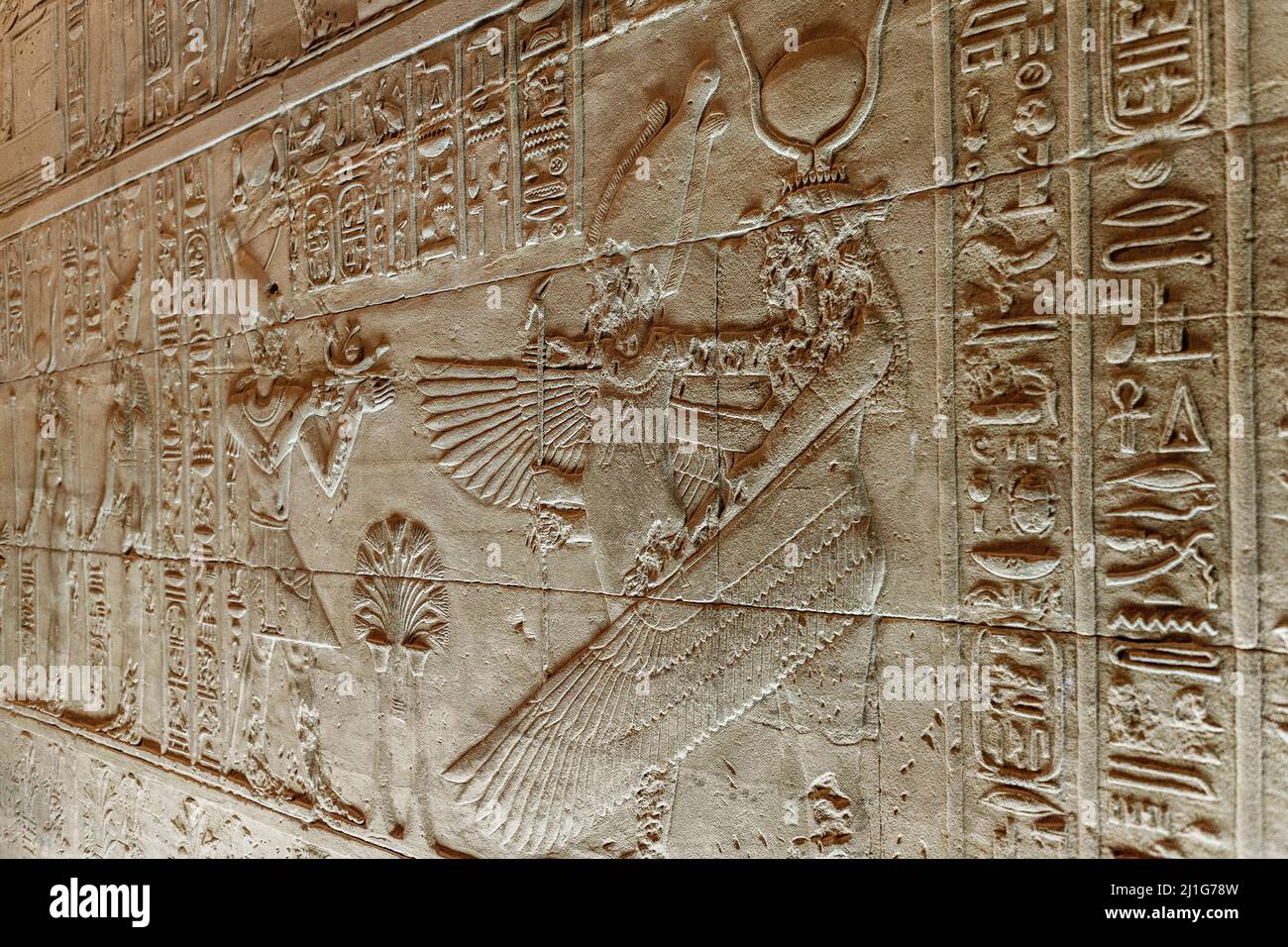 Isis protecting her husband Osiris with her outstretched wings while ...