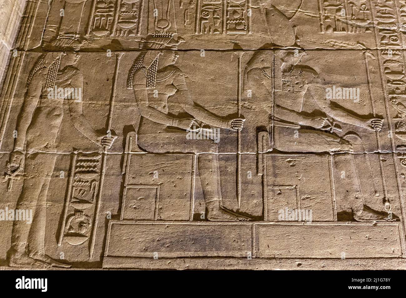 Hathor with the seated figures of Isis and Horus in the Temple of Isis ...