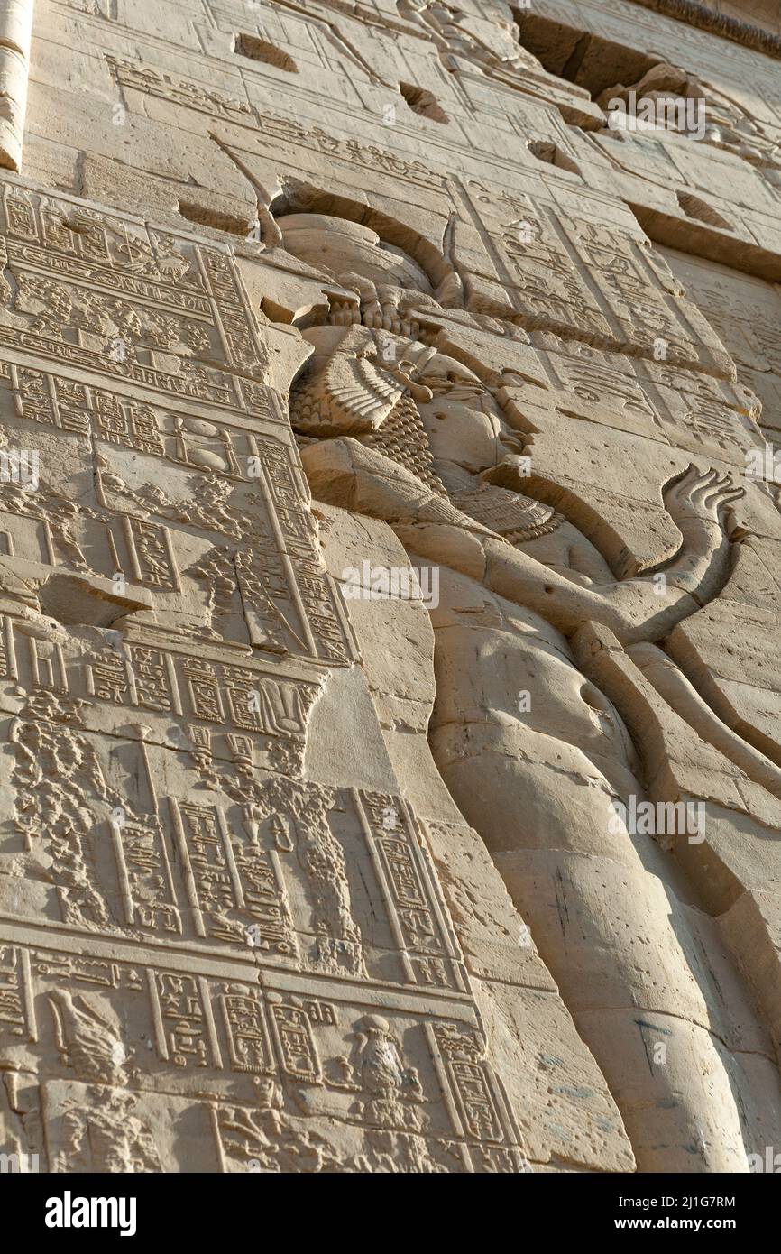Bas-relief carving of the goddess Isis, second pylon of the Temple of ...