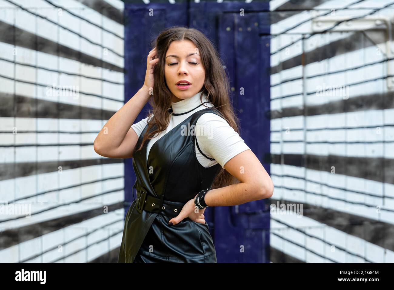 portrait of a young flirty funny woman on the background of a 3d three ...