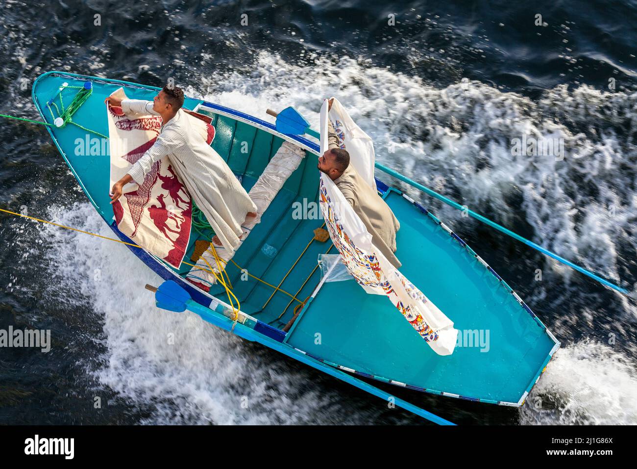 Local traders plying their wares from a boat attached to a Nile cruise ...