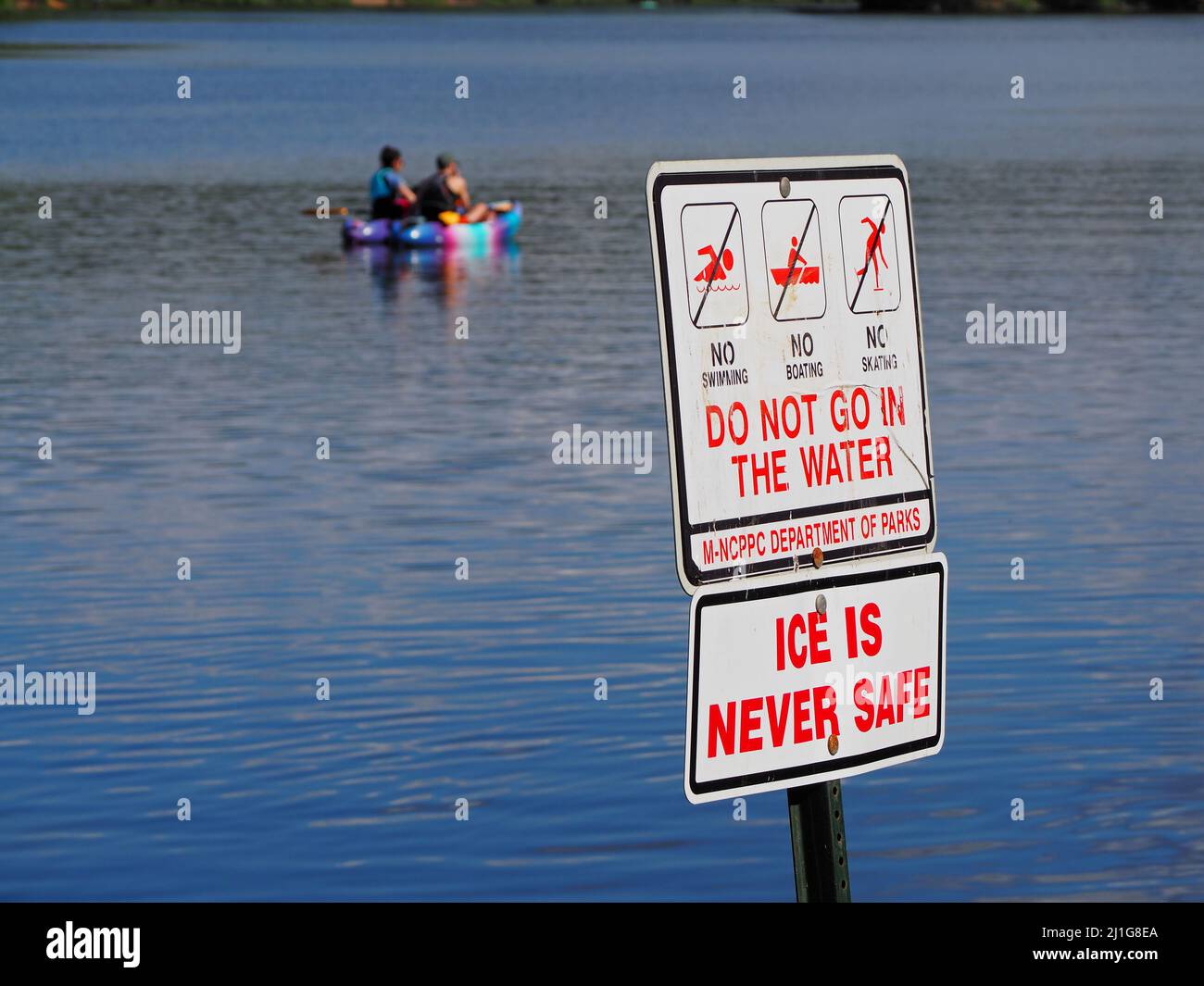 A warning sign on the lakeshore. DO NOT GO IN THE WATER, ICE IS NEVER ...