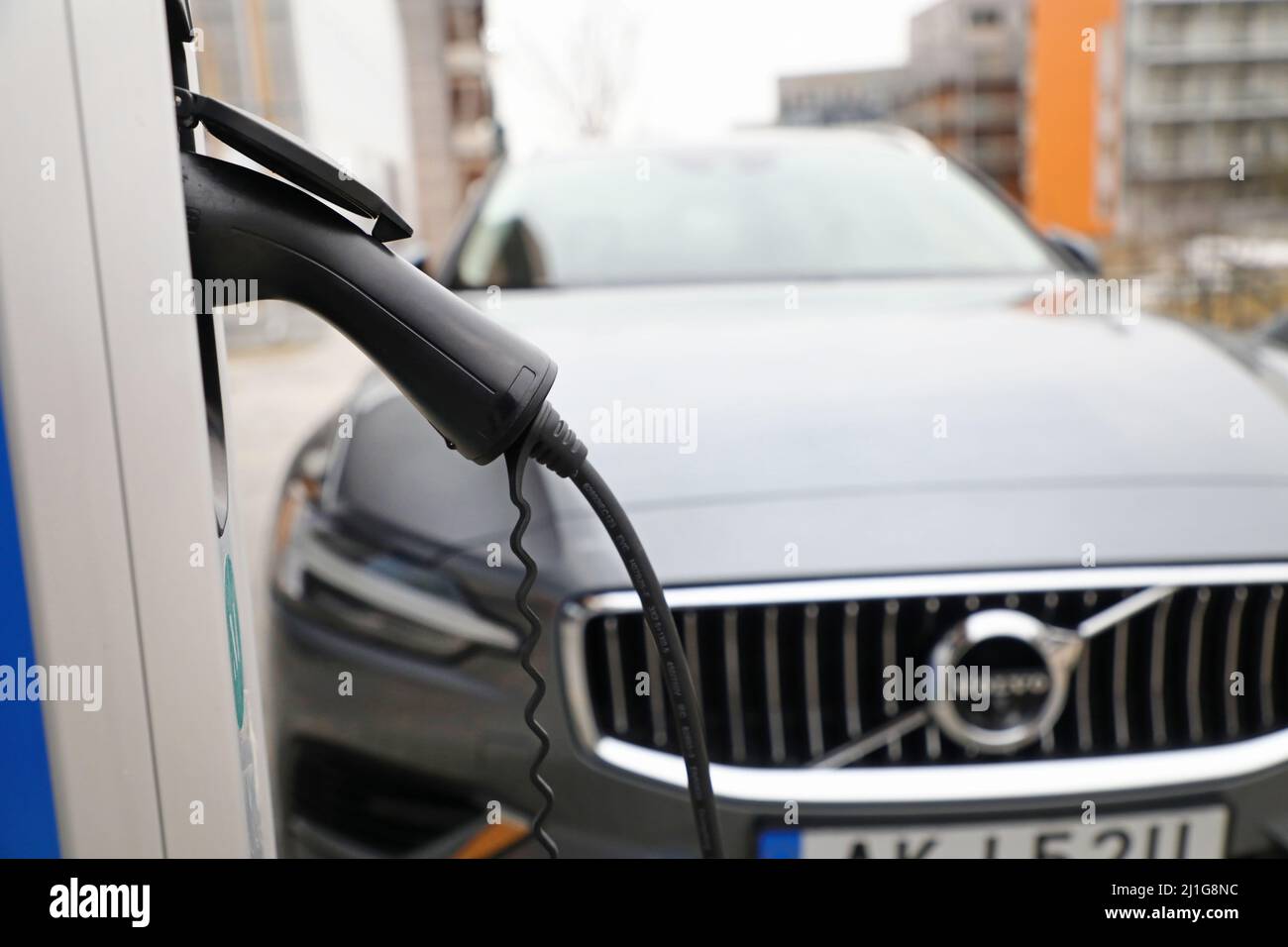Electric cars in a car pool in a residential area that is charged at ...