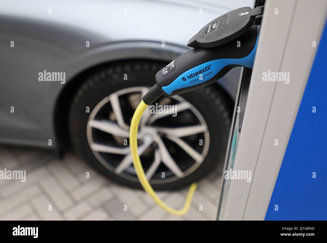 Electric cars in a car pool in a residential area that is charged at ...