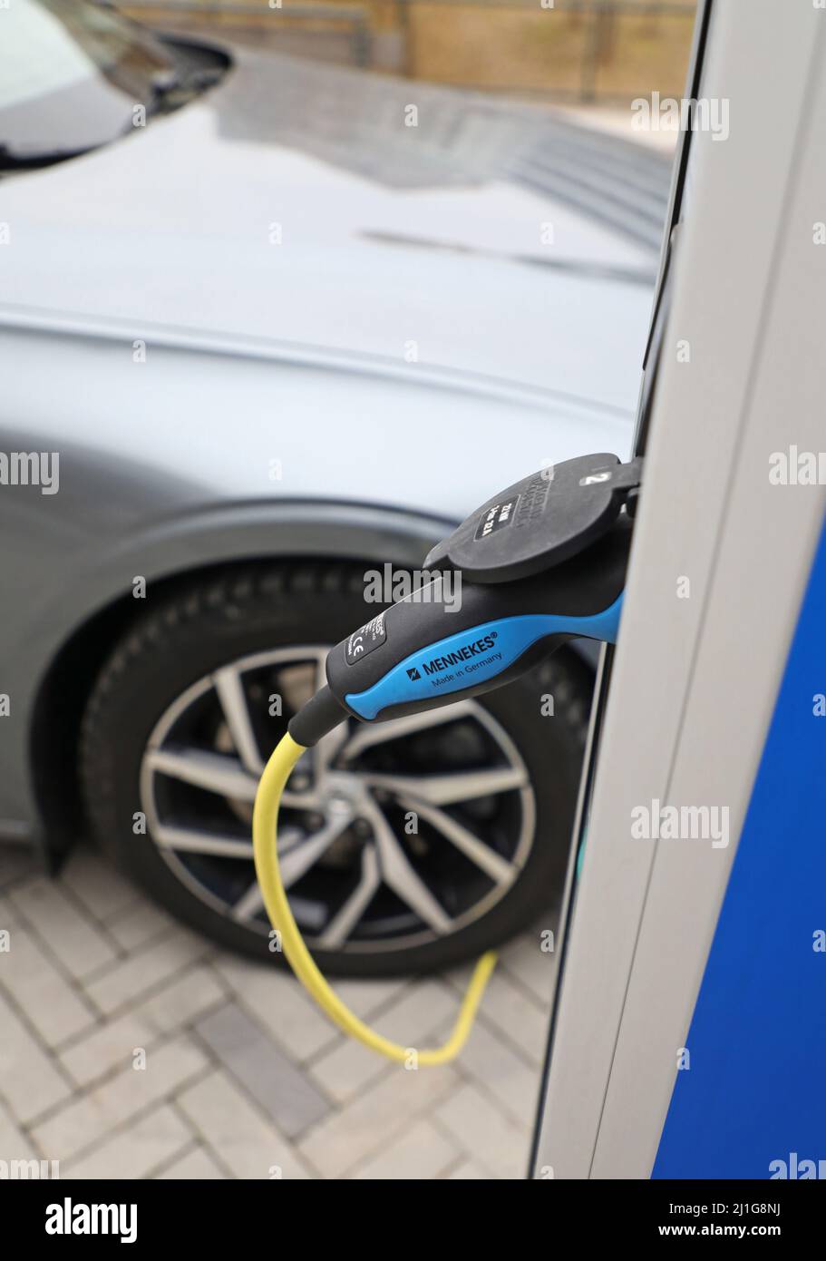 Electric cars in a car pool in a residential area that is charged at ...