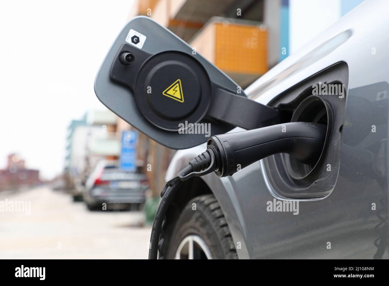 Electric cars in a car pool in a residential area that is charged at ...