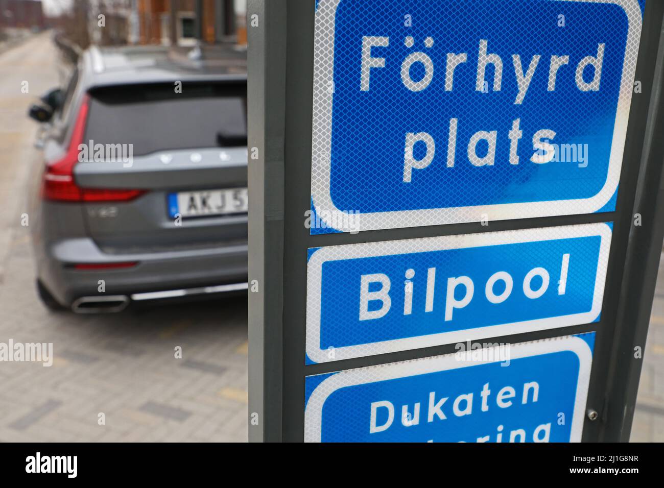 Electric cars in a car pool in a residential area that is charged at ...
