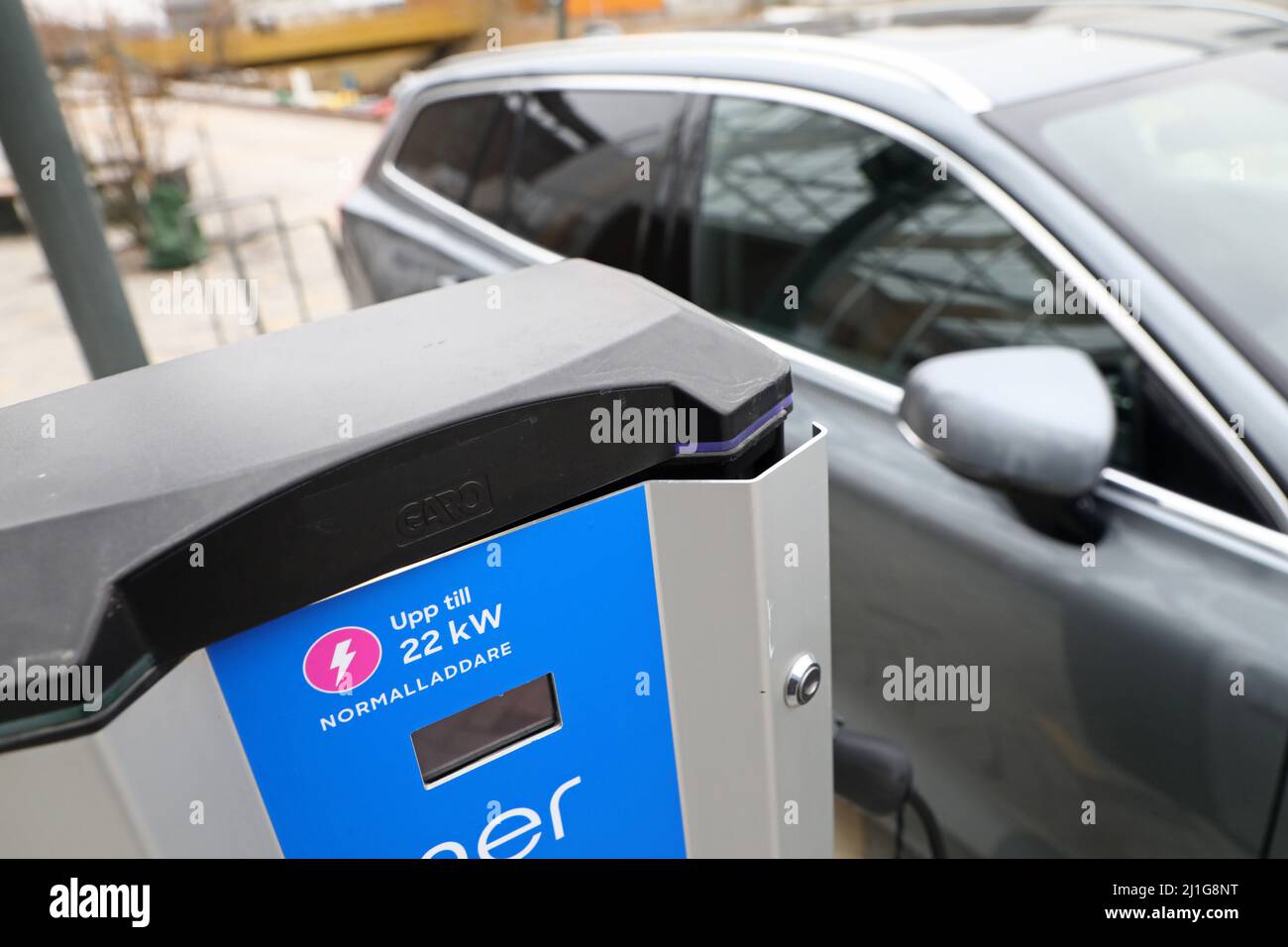 Electric cars in a car pool in a residential area that is charged at ...
