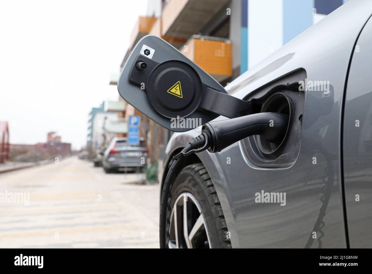 Electric cars in a car pool in a residential area that is charged at ...