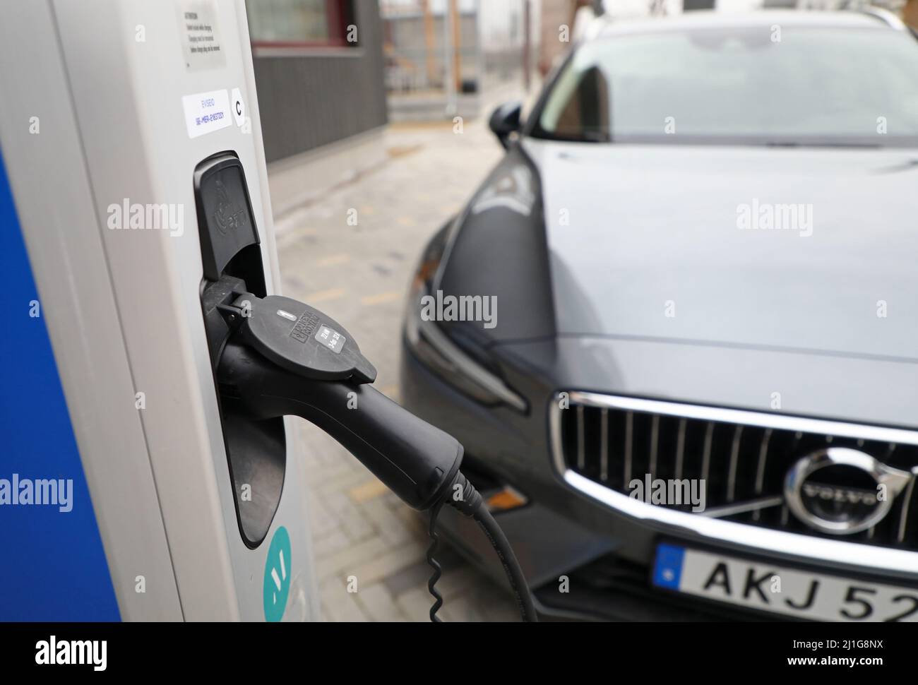 Electric cars in a car pool in a residential area that is charged at ...