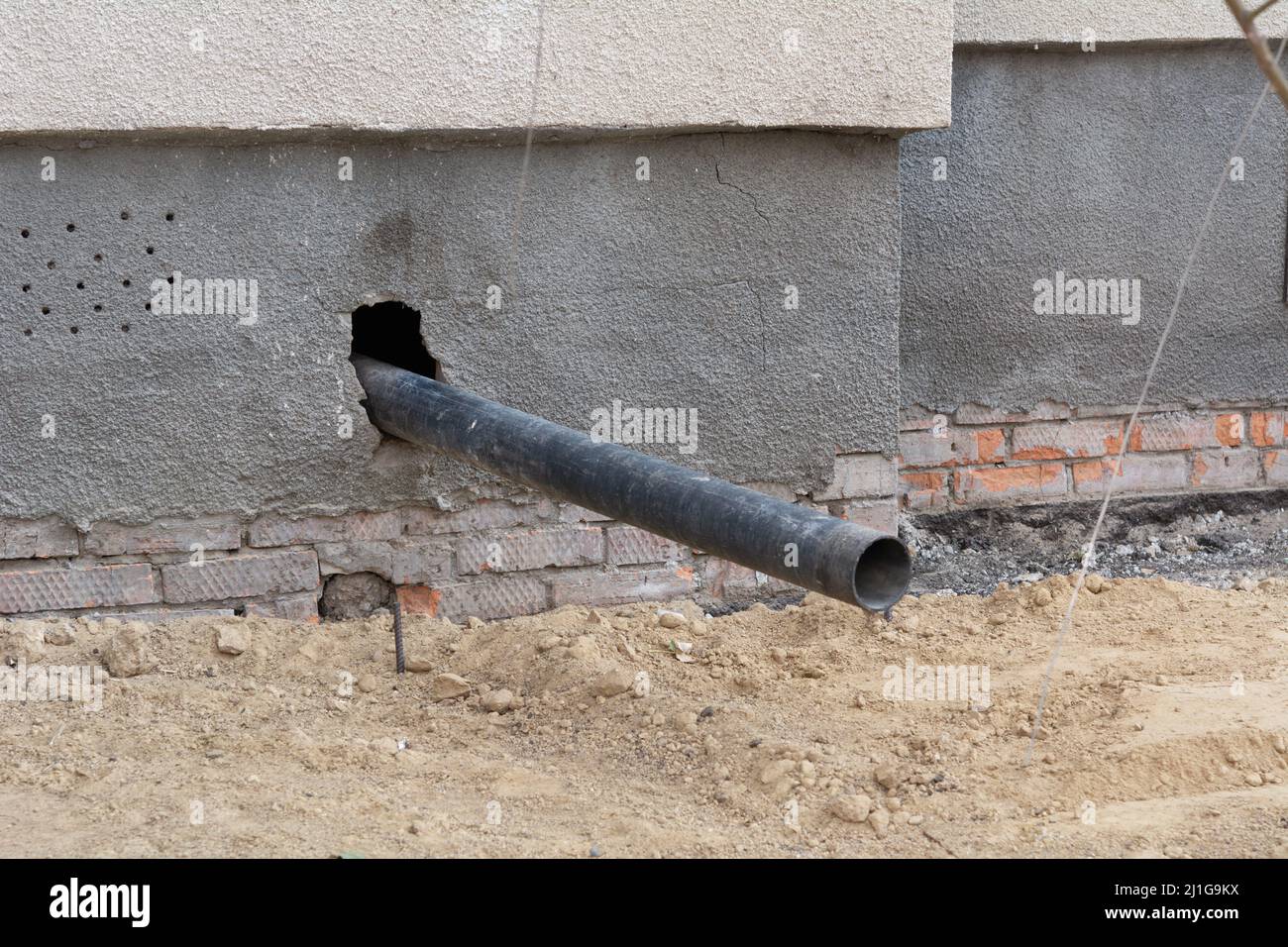 Rainwater pipe. Rain water draining gutter pipe of a house. Plastic ...