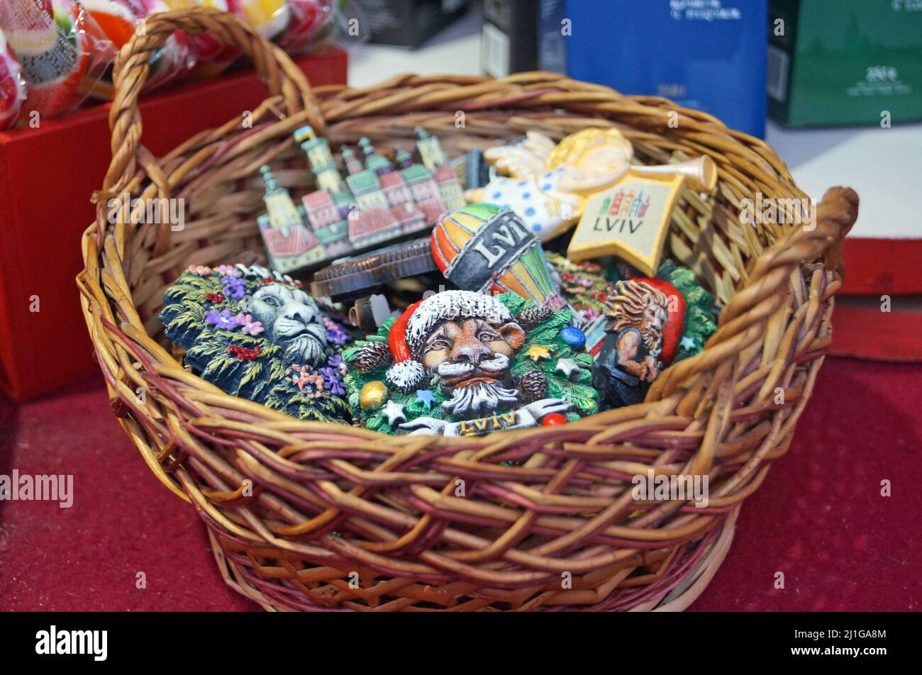 Wicker basket with decorative ceramic magnets with images of the lion ...
