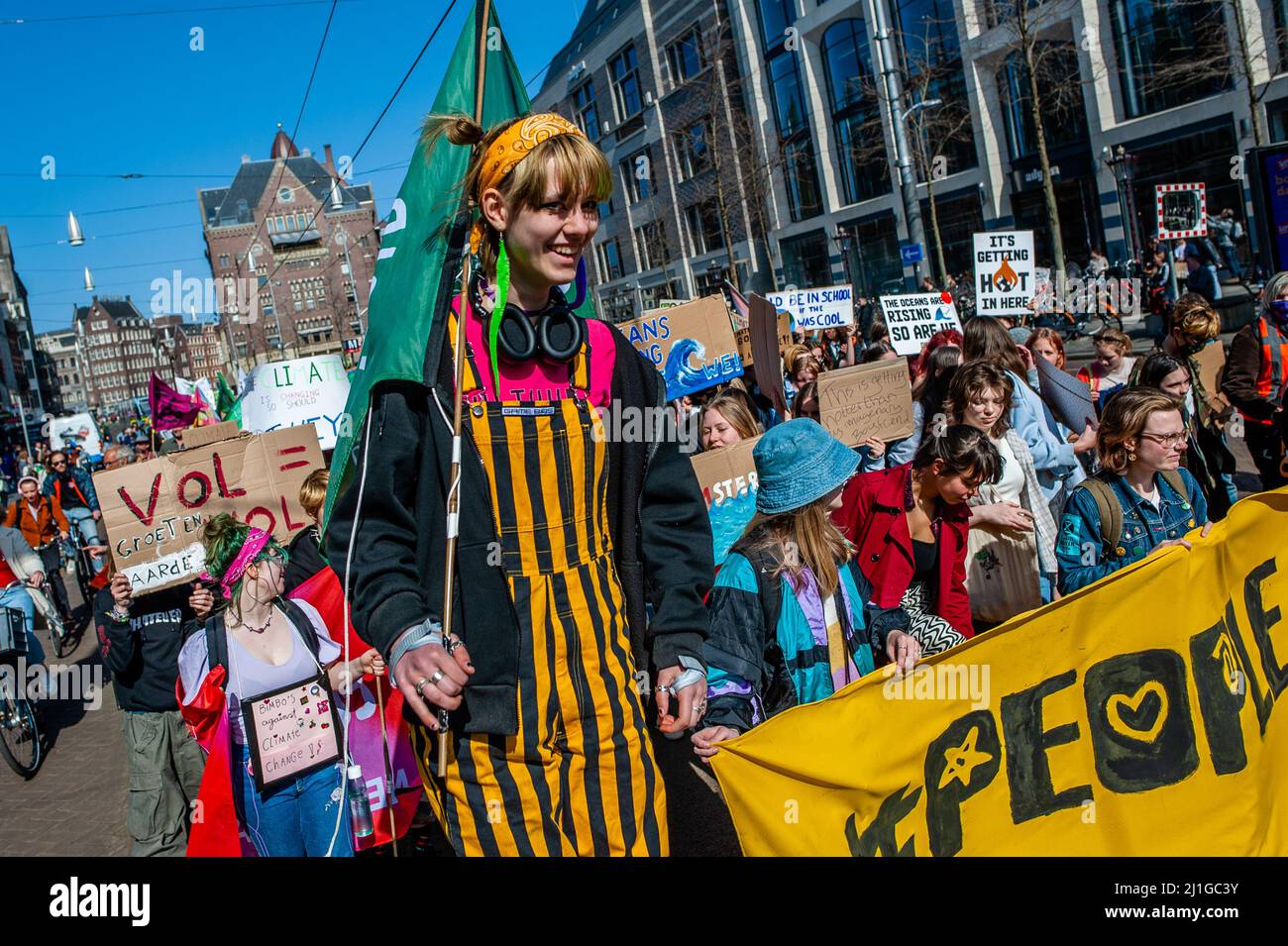 Amsterdam, Netherlands. 25th Mar, 2022. Protesters hold a banner and ...