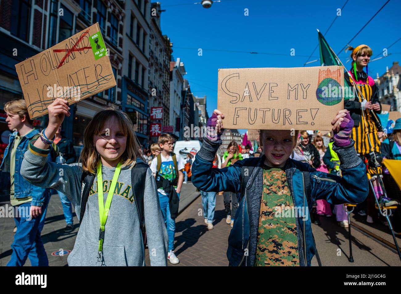 Amsterdam, Netherlands. 25th Mar, 2022. Protesters hold placards ...