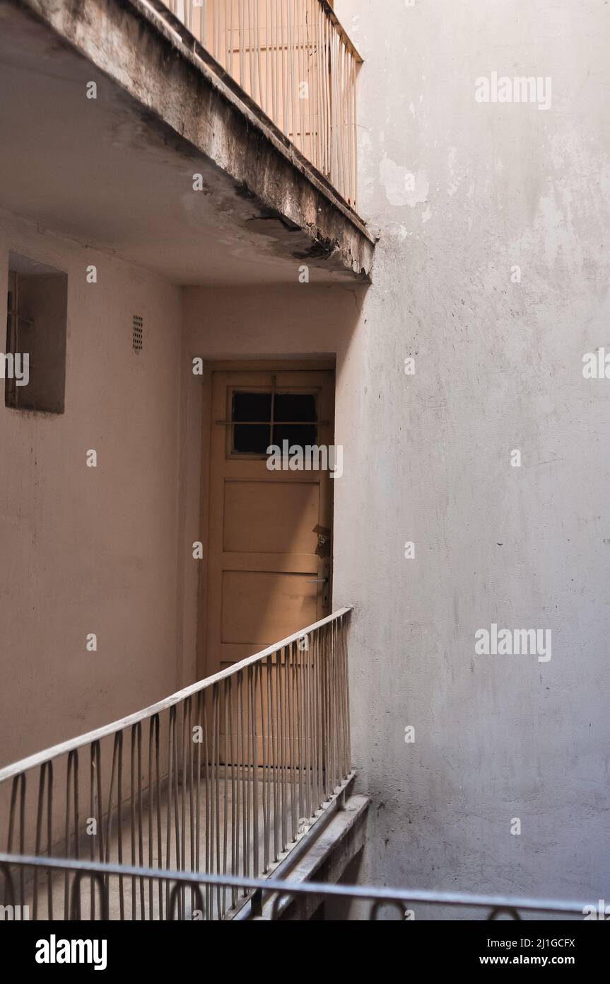 Old empty building with door and railings inside view Stock Photo - Alamy