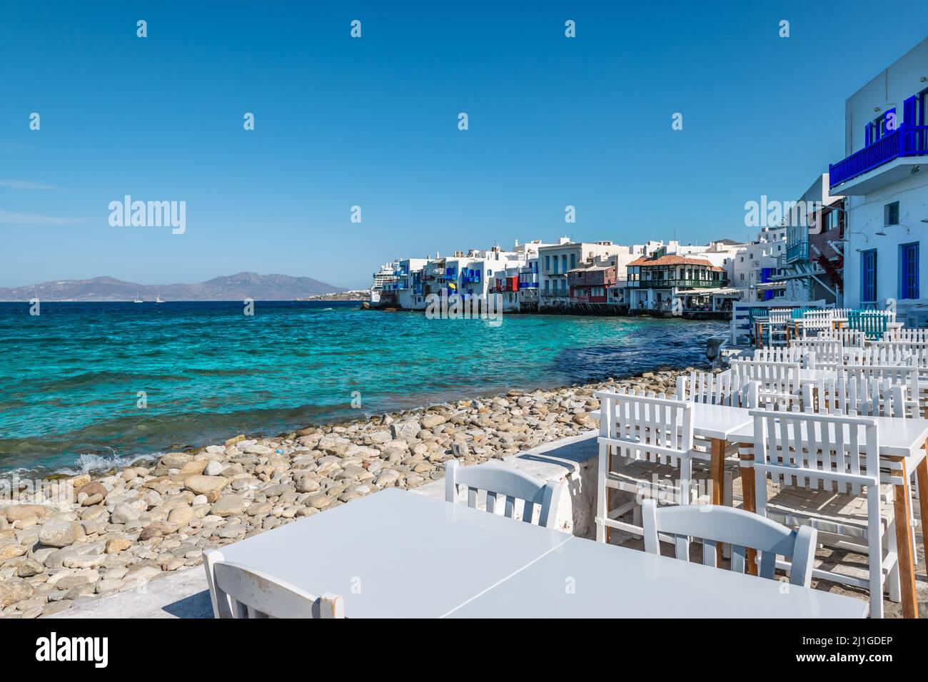 Mykonos, Greece. Tables and chairs by the waterfront in Little Venice ...
