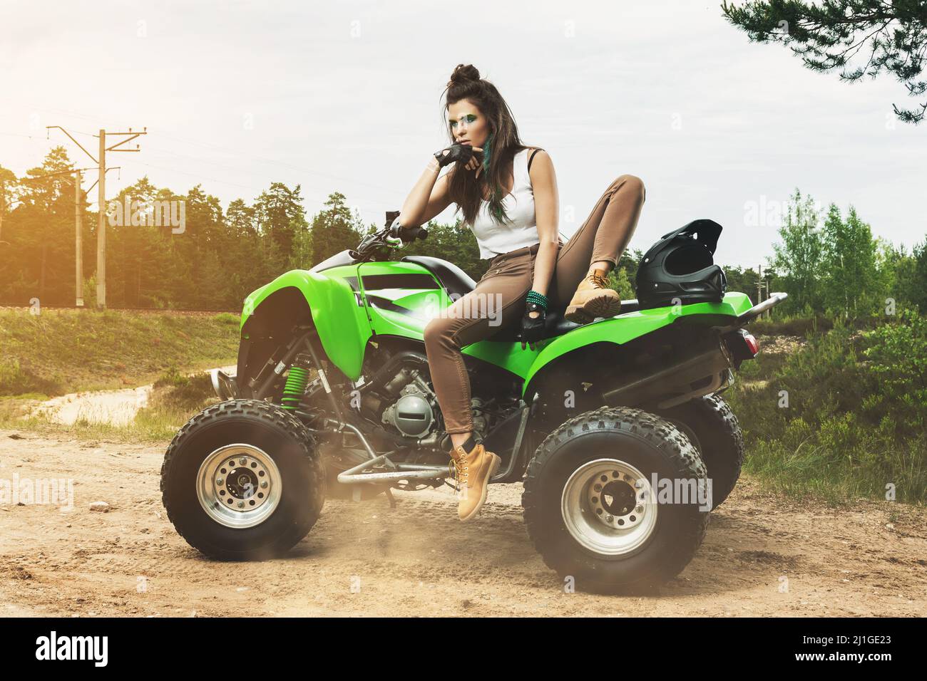 Stylish and beautiful woman and the ATV Stock Photo - Alamy
