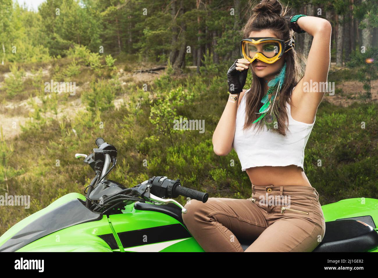 Stylish and beautiful woman and the ATV Stock Photo - Alamy