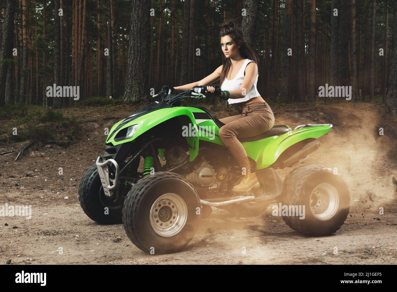 Stylish and beautiful woman and the ATV Stock Photo - Alamy