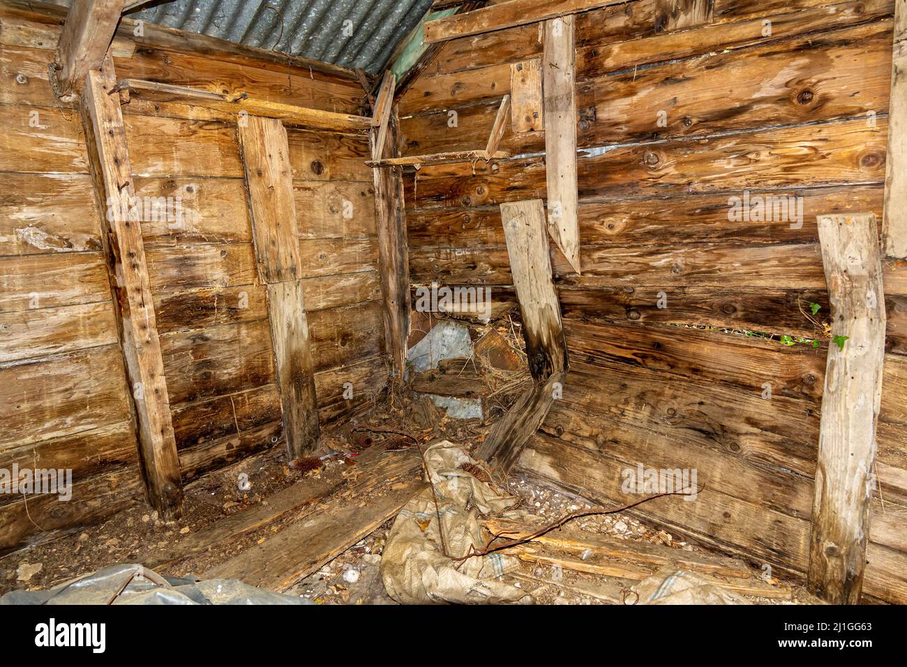 interior of old wooden shack, dilapidated ancient and abandoned in the ...