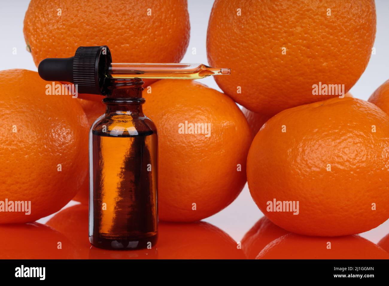 Orange extract has anti-cancer properties. A dropper on a background of ...