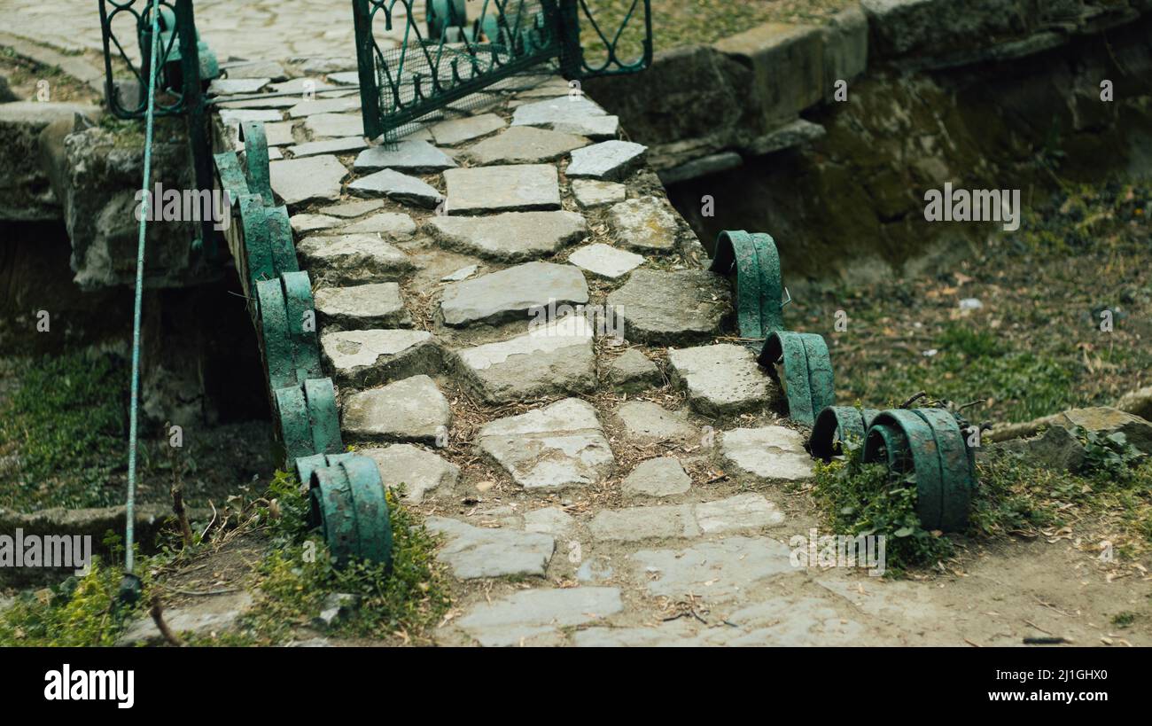 Small stone and wrought iron bridge Stock Photo - Alamy